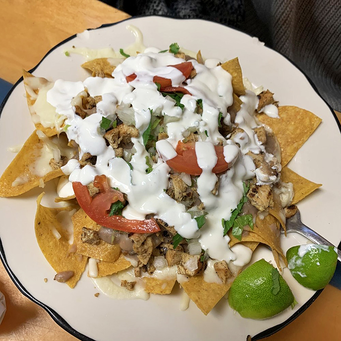 Layer upon glorious layer of chicken, cheese, and toppings—proof that sometimes the best things in life require both hands and extra napkins.