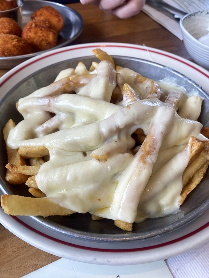 New Jersey's beloved disco fries&mdash;where French fries meet their destiny under a blanket of melted cheese and gravy. Midnight salvation on a plate.