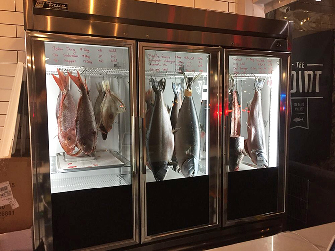 The dry-aging refrigerator is like a museum of finned masterpieces, each fish suspended in time until it reaches peak deliciousness.