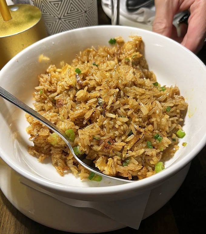 Dungeness crab fried rice that whispers "comfort food" but shouts "culinary masterpiece" with every savory, perfectly seasoned bite.