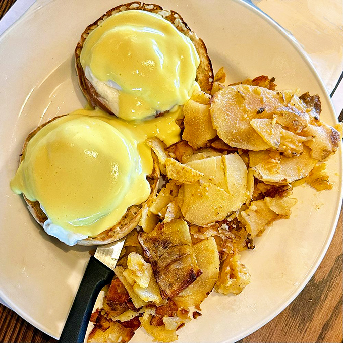 Eggs Benedict: where hollandaise sauce flows like liquid gold over English muffins. Those home fries are the supporting actors who steal the show.