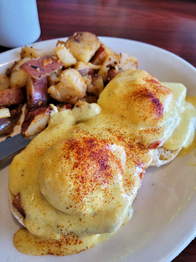 Eggs Benedict that would make a cardinal sin. Perfectly poached eggs under hollandaise with a paprika kiss and home fries that mean business.