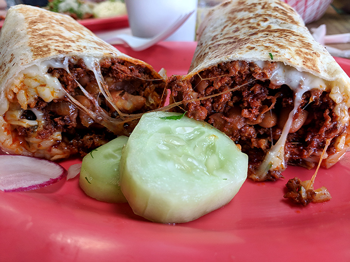 Cheese stretching like a suspension bridge between bites, this burrito doesn't just satisfy hunger &ndash; it creates food memories that haunt your dreams.