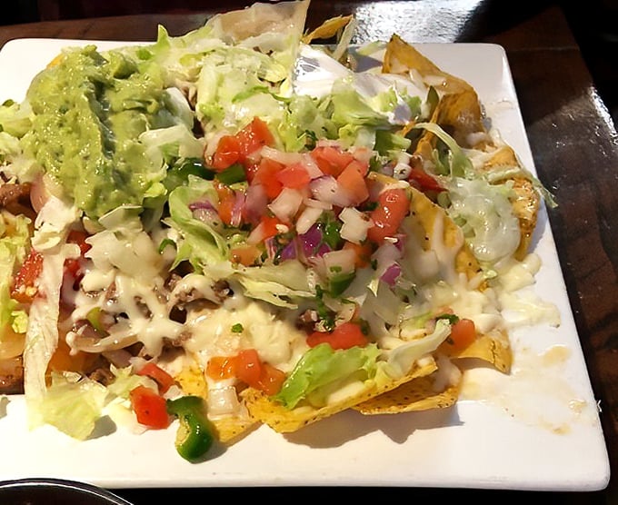 These nachos don't play by the rules&mdash;fresh lettuce, pico, and guacamole transform a bar snack into a legitimate meal worth bragging about.