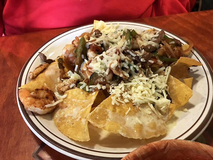 Fajita nachos: where sizzling proteins meet crispy chips in holy matrimony. The cheese pull alone deserves its own Instagram account.