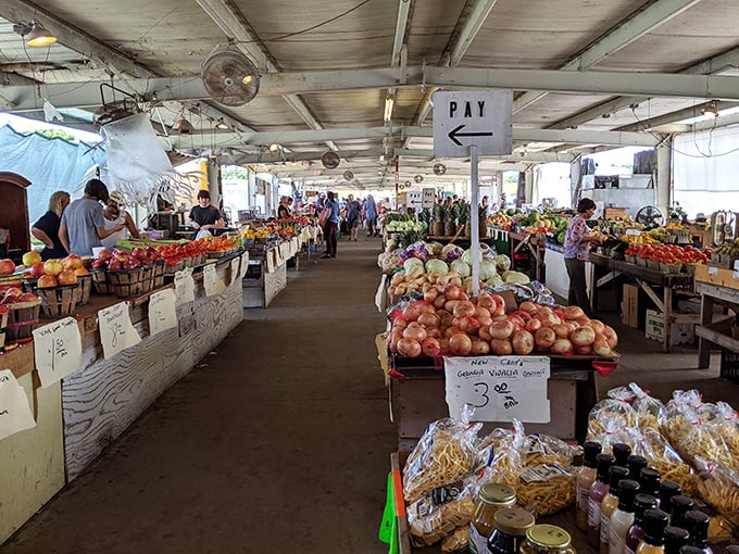 The farmer's market section: where vegetables are celebrities and shoppers become paparazzi with shopping bags instead of cameras. 
