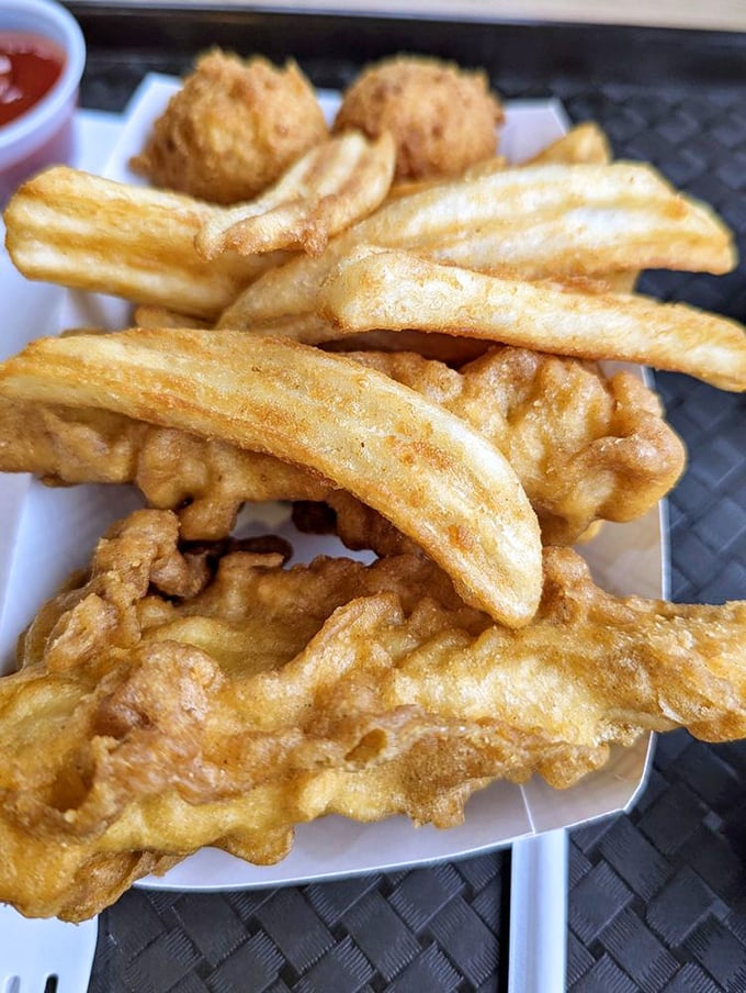 The fish and chips platter &ndash; where crispy batter meets flaky white fish in a marriage so perfect it deserves its own reality show.