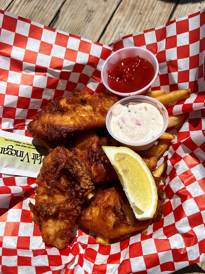 Golden-battered fish and hand-cut fries served in a red checkered basket&mdash;the kind of simple pleasure that makes you question why anyone would eat anything else.