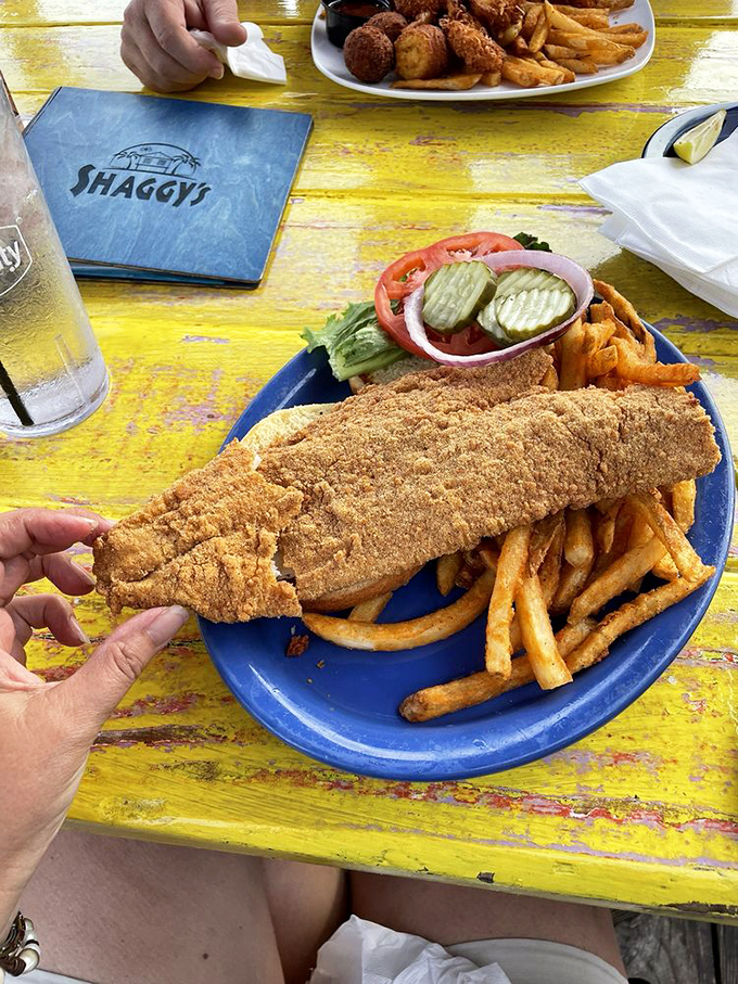 This isn't just fried fish; it's edible sunshine with a crispy crust. The tartar sauce looks like it could make cardboard taste delicious.