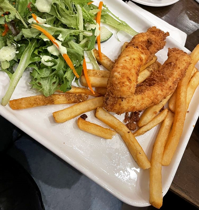 Who says healthy and delicious can't share a plate? Crispy fish and fries find balance with a garden-fresh salad in this picture-perfect lunch.