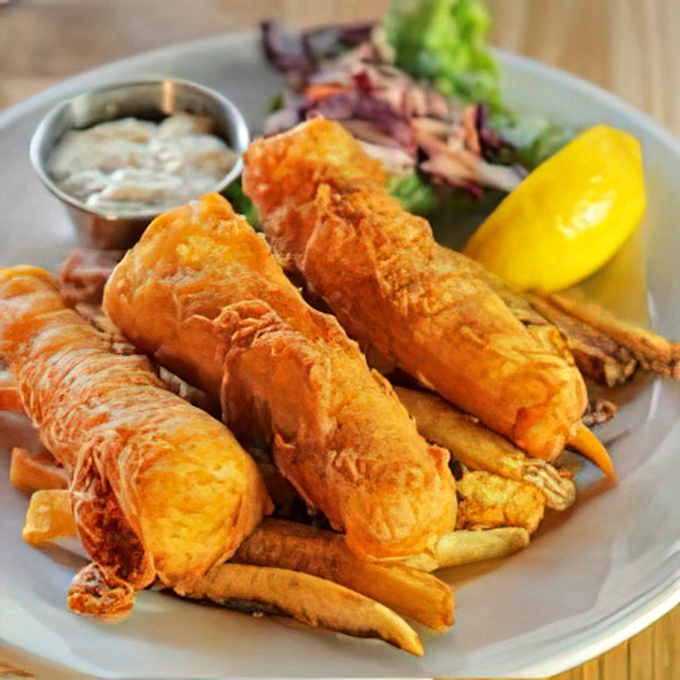 The star of the show: beer-battered fish with a crackling exterior giving way to flaky, tender cod. This isn't just food&mdash;it's edible joy.