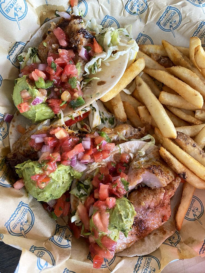 These fish tacos don't just swim, they soar&mdash;crispy battered fish, fresh pico, creamy avocado, and a side of golden fries that demand equal attention.
