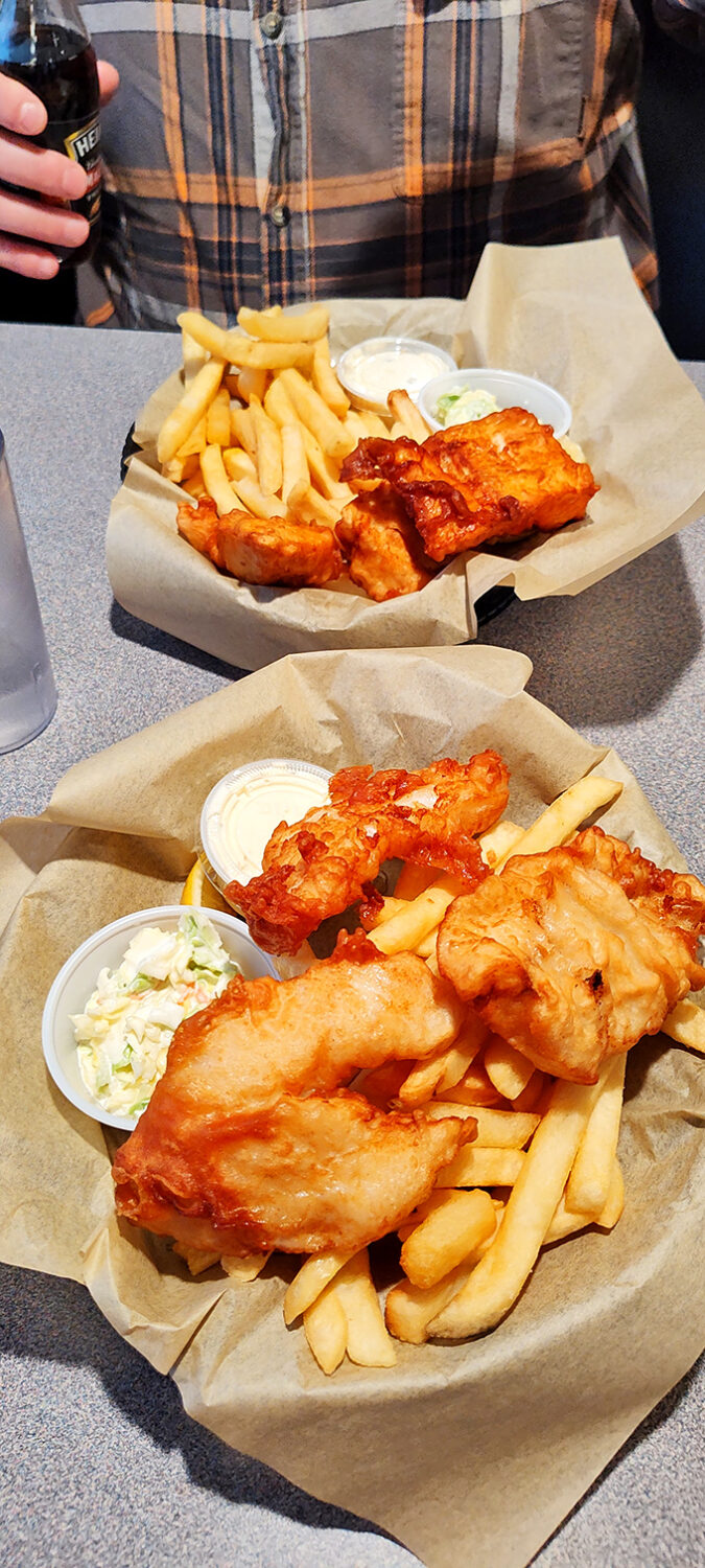 Golden-battered fish and crispy fries served unpretentiously in paper baskets. Coastal comfort food that doesn't need white tablecloths to prove its worth.