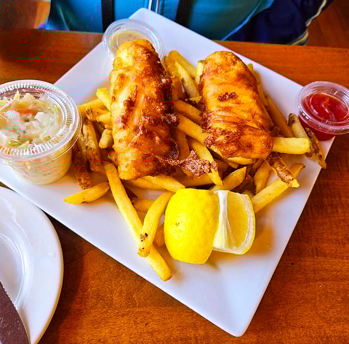 The star of the show: golden-battered fish and chips that crackle with each bite, served with a lemon wedge that's not just garnish&mdash;it's essential seasoning.