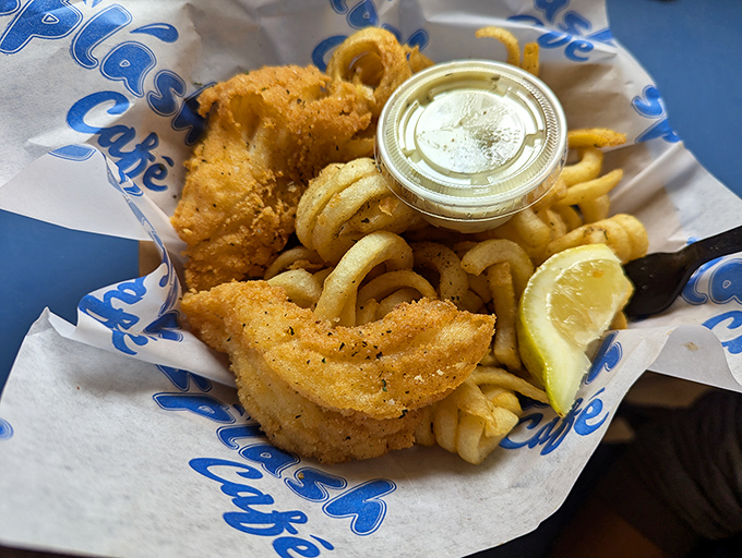 Fish and chips that would make Neptune himself swim to shore—golden, crispy, and served with a lemon wedge for that perfect zing.