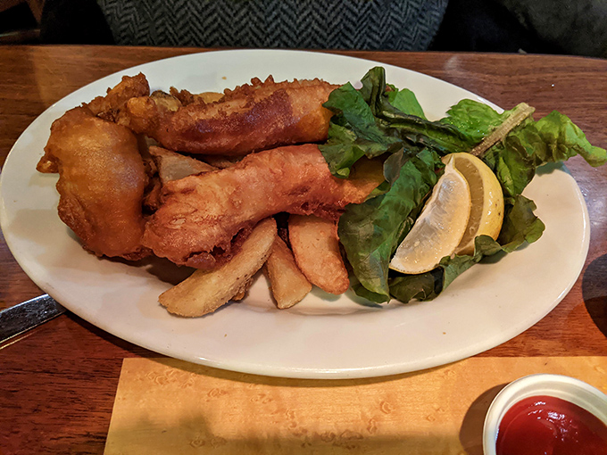 A classic presentation that lets the star shine. That crispy batter shatters just right, revealing flaky white fish that's moist and tender.