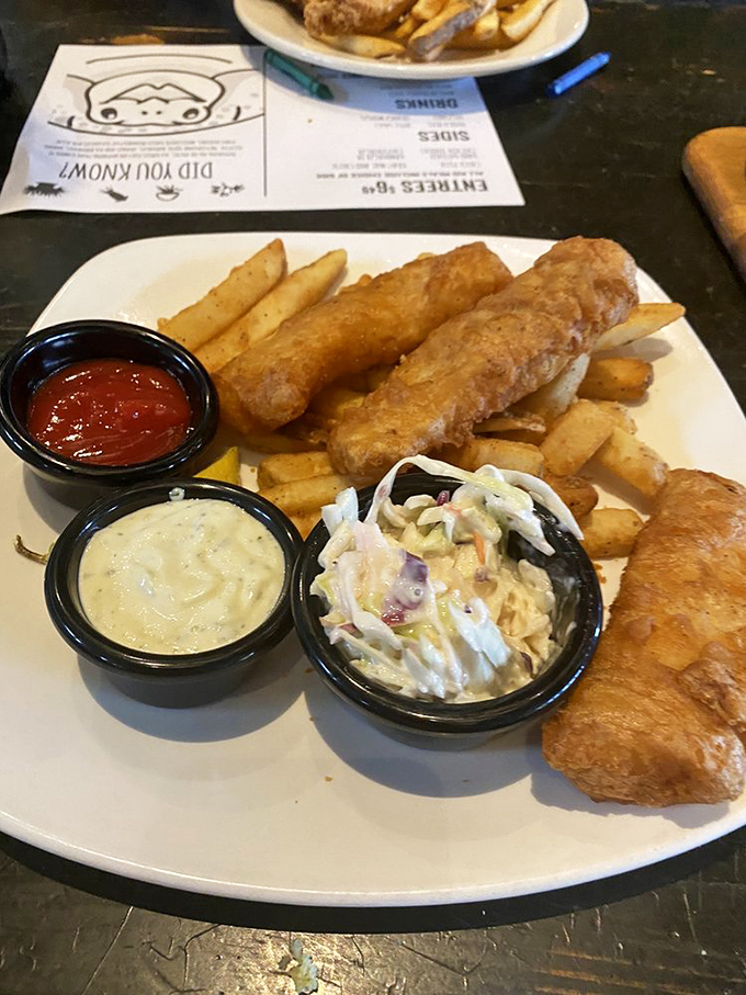 The holy trinity of fish and chips perfection: crispy exterior, flaky interior, and sides that don't know they're supposed to be afterthoughts.
