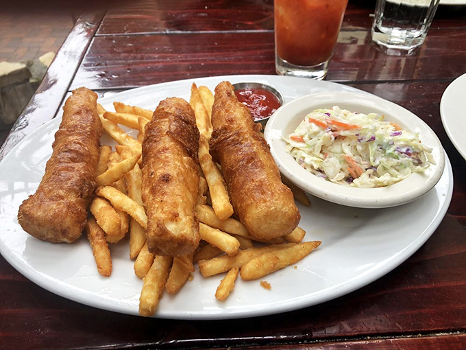 These golden-battered fish fillets aren't just fish and chips&mdash;they're crispy vessels of happiness served with a side of coastal nostalgia.