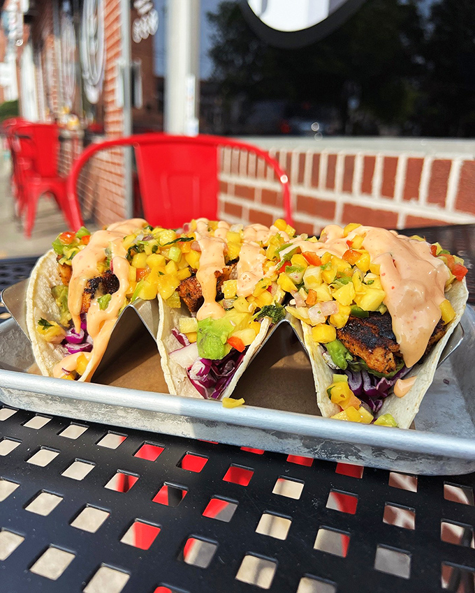 These tacos don't need Tuesday as an excuse—vibrant mango salsa and purple cabbage create edible artwork worth crossing state lines for.