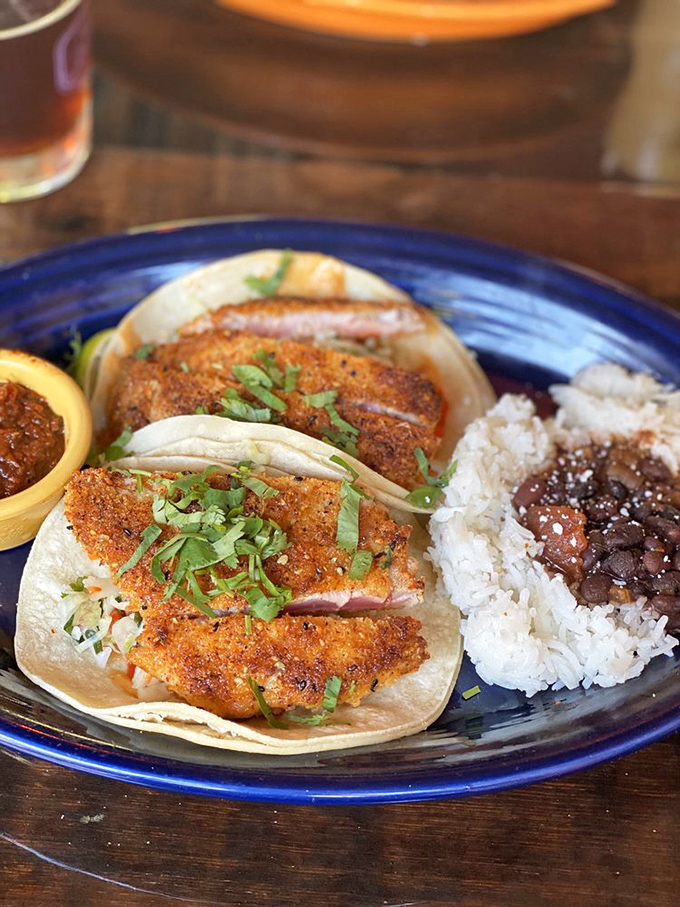 Fish tacos that make you wonder why you'd ever eat anything else. Perfectly seasoned, expertly cooked, and served with that essential side of rice and beans.