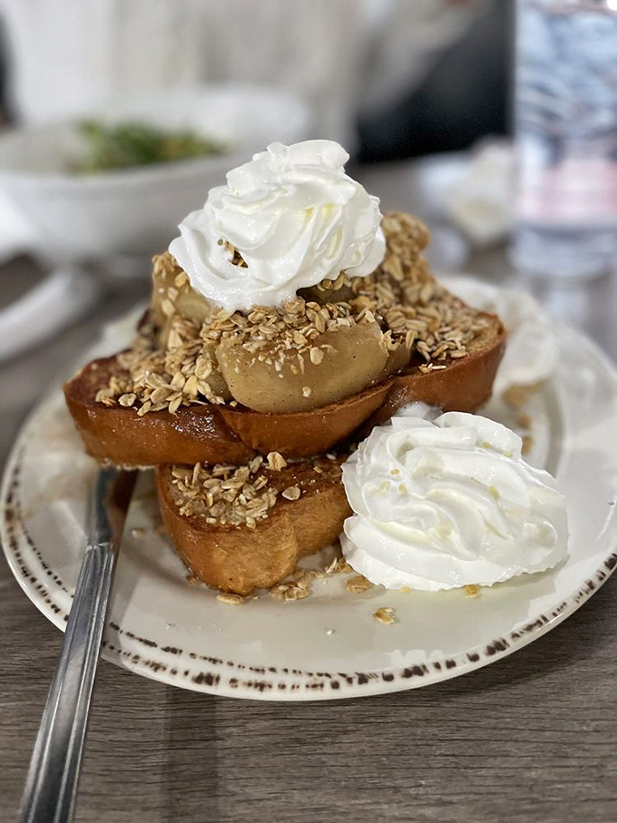 French toast that's dressed for success with caramelized apples, granola crunch, and whipped cream islands. Breakfast or dessert? The line deliciously blurs.