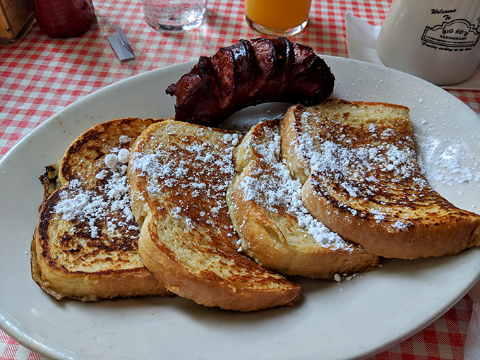French toast that's dressed for success with a dusting of powdered sugar and a side of sausage that means business.