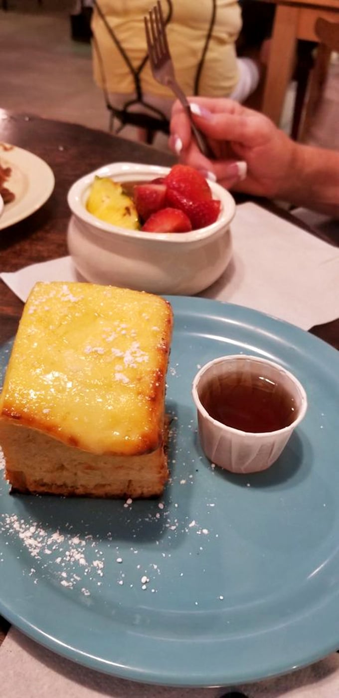 Their French toast arrives like a golden brick of breakfast joy, accompanied by fresh fruit that makes you feel slightly virtuous.