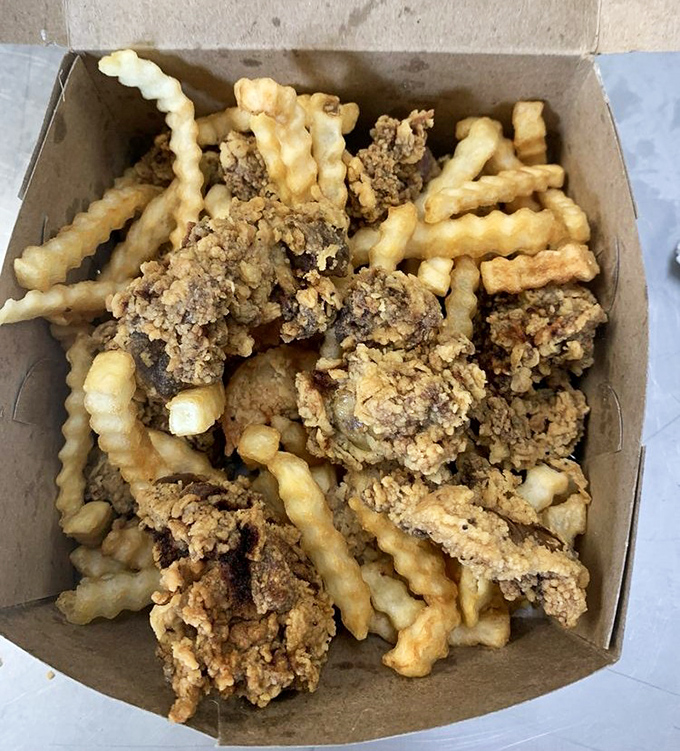 Chicken livers and crinkle-cut fries—the combo that separates the culinary adventurers from the tourists. That crispy exterior hides a rich, velvety center.
