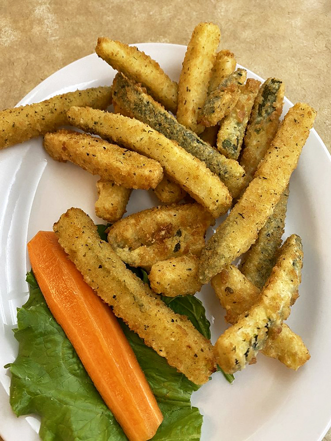 These crispy zucchini soldiers stand at attention, ready to be dipped in that sunshine-yellow sauce. Vegetables playing dress-up.