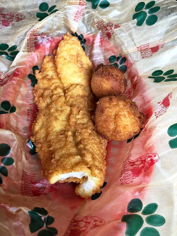 This isn't just fried catfish; it's a Southern baptism in golden batter, served with hushpuppies that could make a preacher skip Sunday service.