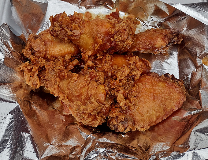 Fried chicken so perfectly golden, it deserves its own trophy and acceptance speech. The crunch is practically audible through the photo.