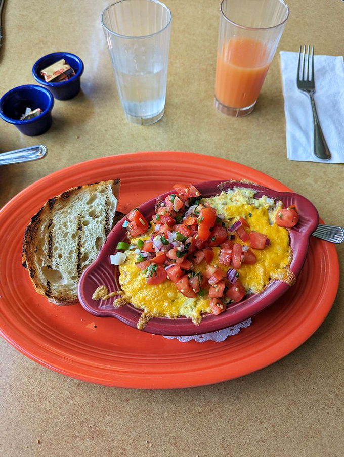 Eggs wearing a fresh tomato salsa hat, served in a dish that's the color of happiness. Breakfast doesn't get more photogenic than this.