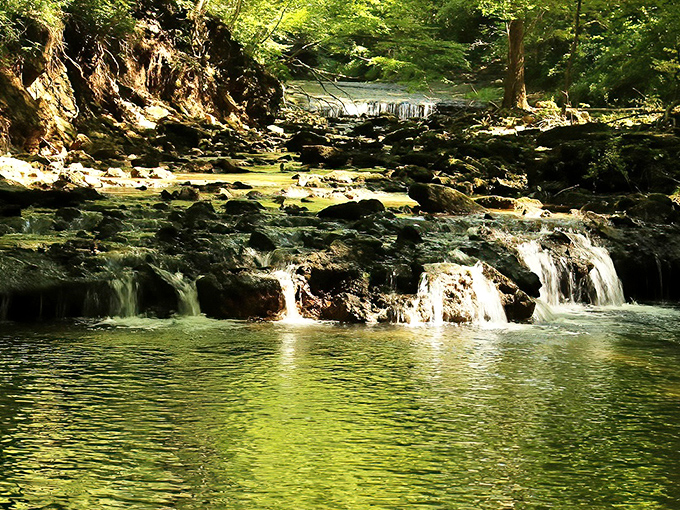 The famous Yellow Spring itself, where mineral-rich waters create nature's own artwork, staining rocks with golden hues that gave this magical town its name.