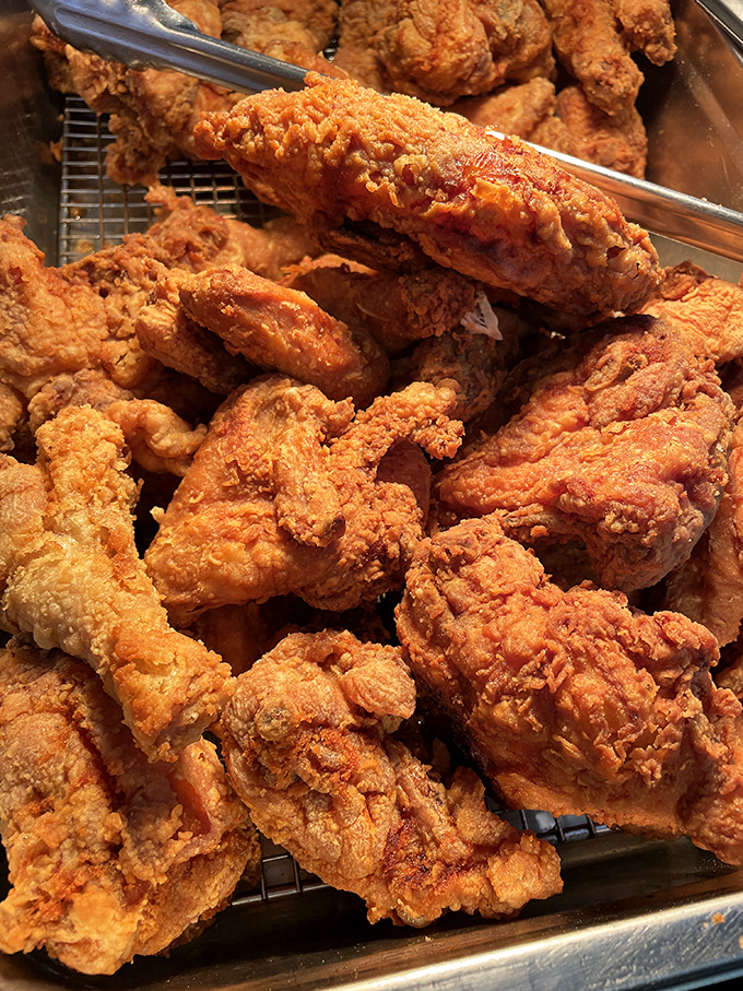 Behold the chicken that launched a thousand food pilgrimages, its crust shattering with each bite like crispy love letters to your palate.