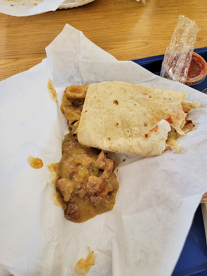 The green chili burrito spills its secrets with each bite, wrapped in that famous tortilla that's worth crossing state lines for.