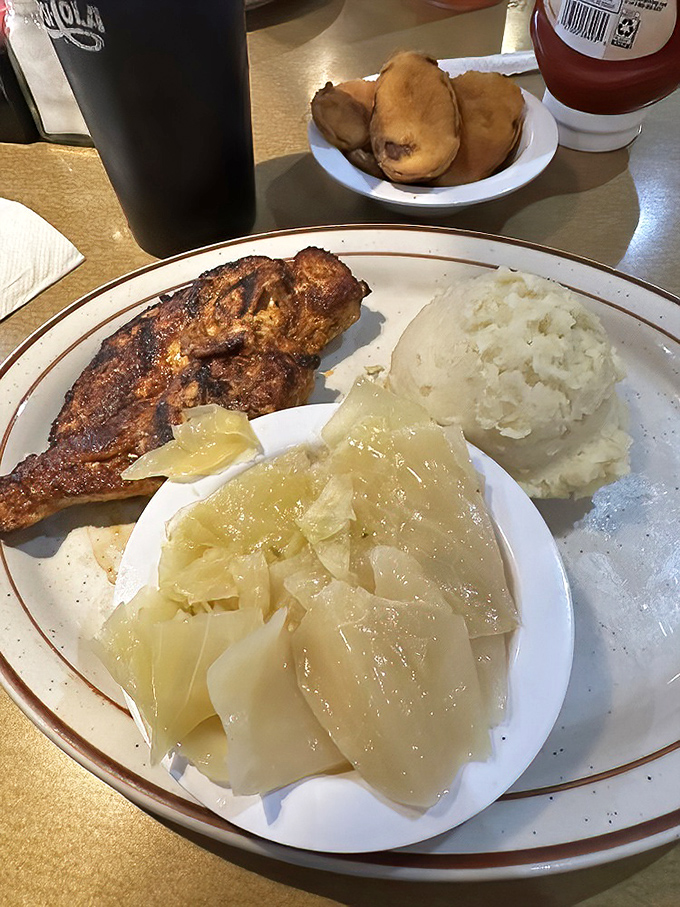 Southern comfort on a plate! That perfectly seasoned chicken alongside creamy mashed potatoes and cabbage is the hug your taste buds have been waiting for.