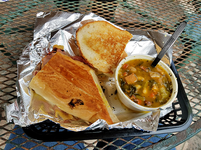 The golden-pressed sandwich alongside that hearty soup is the Florida equivalent of finding both sunshine and a perfect 75-degree day in February.