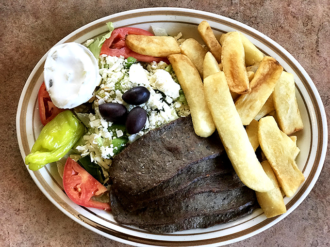 A Greek salad that transports you to the Mediterranean without the airfare. Those fries could start their own fan club.