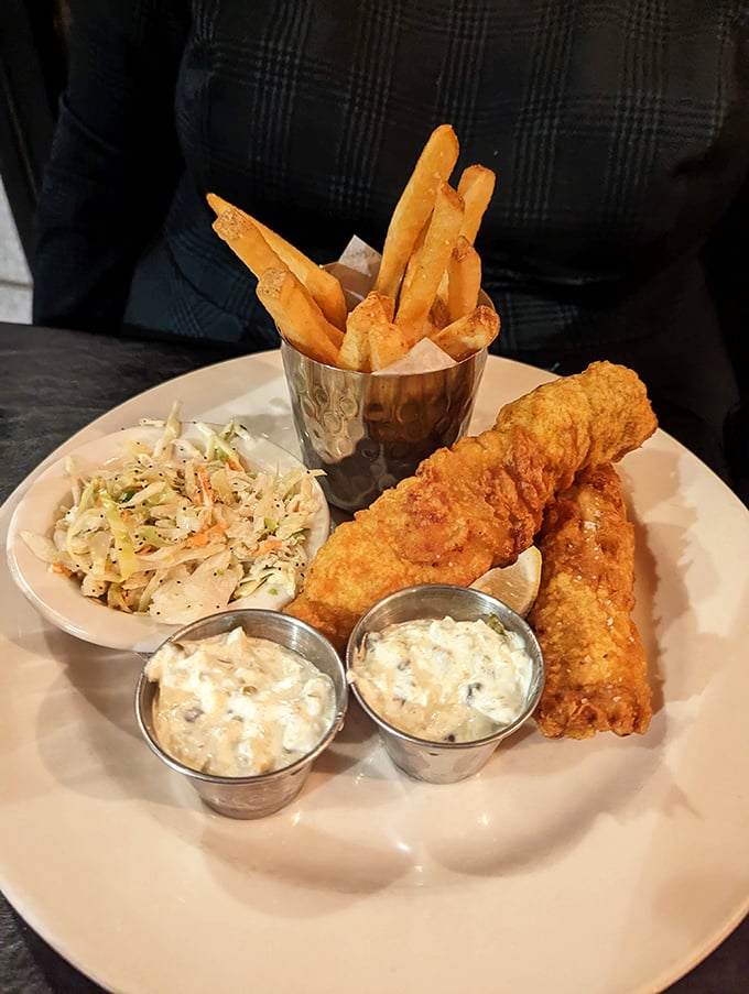 The legendary fish and chips in all their glory &ndash; crispy, flaky, and served with enough tartar sauce for proper dunking protocol.