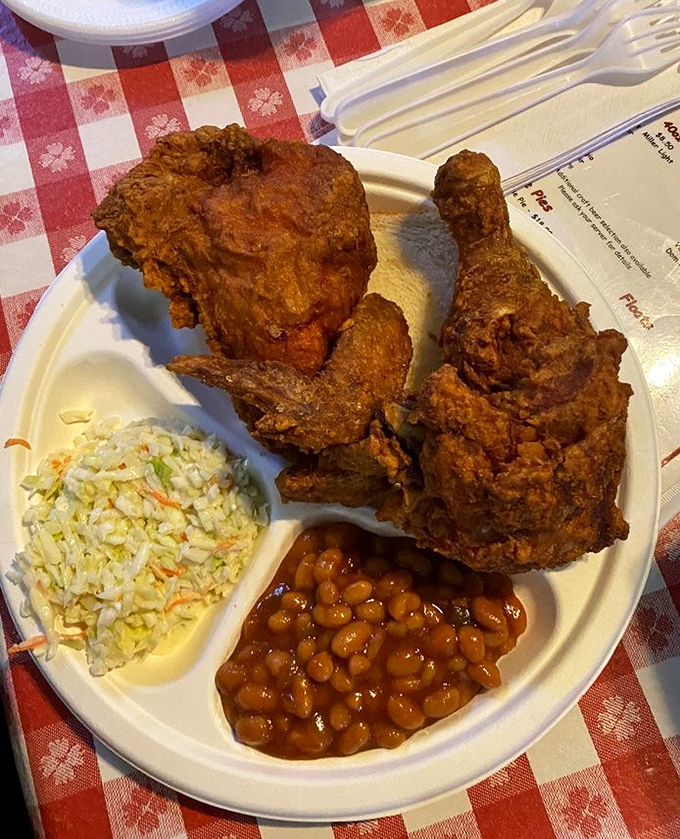 The holy trinity of Southern comfort: crispy fried chicken, creamy coleslaw, and sweet baked beans. The culinary equivalent of a warm hug.