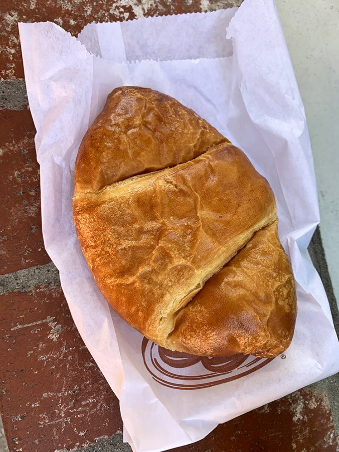 The humble croissant, perfectly executed&mdash;golden, flaky, and substantial. This isn't some dainty European affectation; this is breakfast with purpose.
