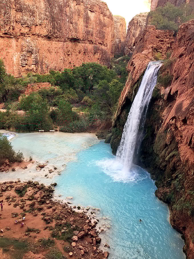 Just a day trip from Seligman, Havasupai Falls cascades into turquoise pools&mdash;Mother Nature showing off with colors that would make a peacock jealous.