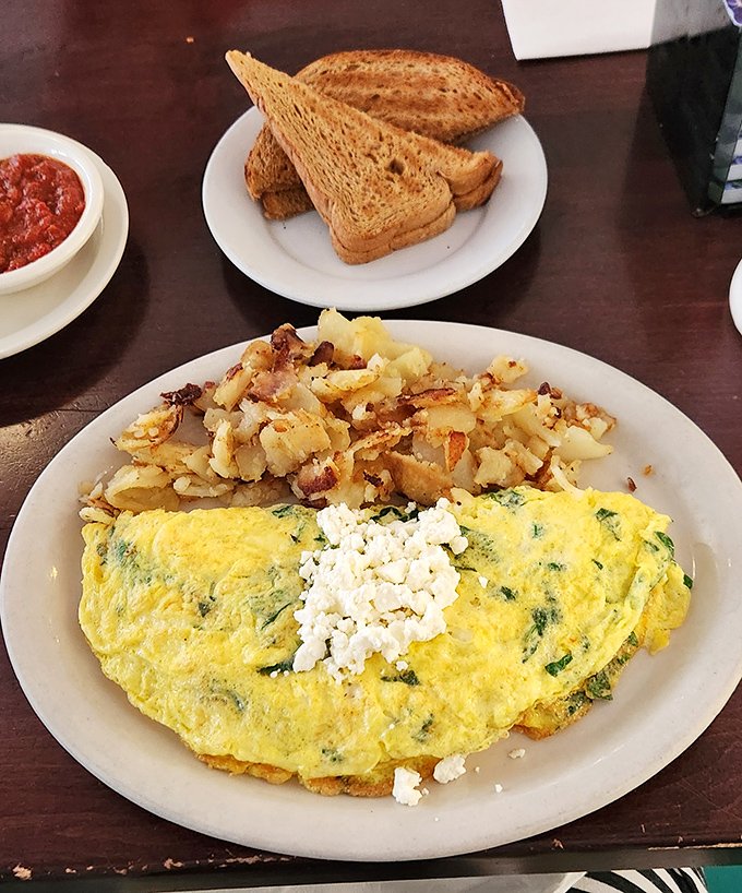 An omelet that's achieved the perfect fluff factor, paired with home fries that strike that elusive crispy-outside, tender-inside balance. Breakfast nirvana exists!