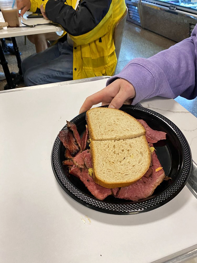 Some sandwiches are eaten; this one is experienced. The hot pastrami on rye deserves a moment of silent reverence before that first life-changing bite.
