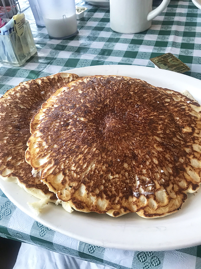 These aren't just pancakes; they're edible frisbees of joy. The plate underneath is basically just moral support at this point.