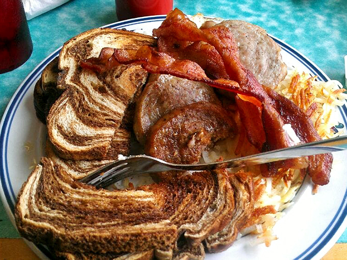 Marbled rye toast, crispy bacon, and hashbrowns that could make a potato proud. This breakfast plate doesn't need a filter to impress.