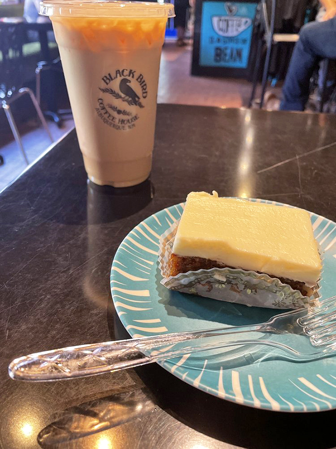 The perfect pairing: A Jack Rabbit specialty coffee alongside carrot cake that's wearing its cream cheese frosting like a crown jewel on a turquoise throne.