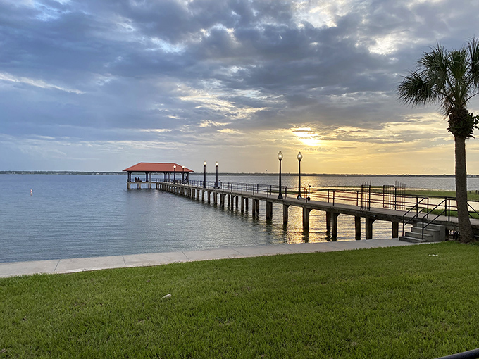 Lake Jackson's pier stretches toward the horizon like an invitation to witness sunsets that coastal residents pay millions to see.