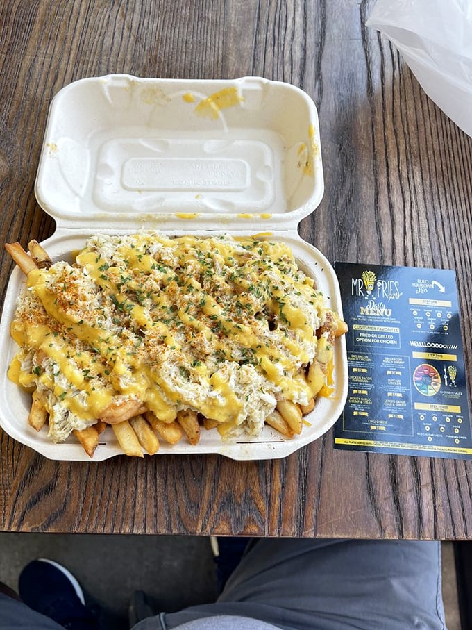 The lemon garlic shrimp and crab combo is what happens when seafood decides french fries are the perfect dance floor.