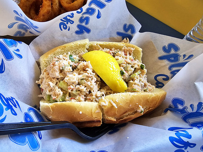 This lobster roll isn't just lunch; it's a coastal vacation between two pieces of bread. The lemon wedge isn't garnish &ndash; it's essential equipment.